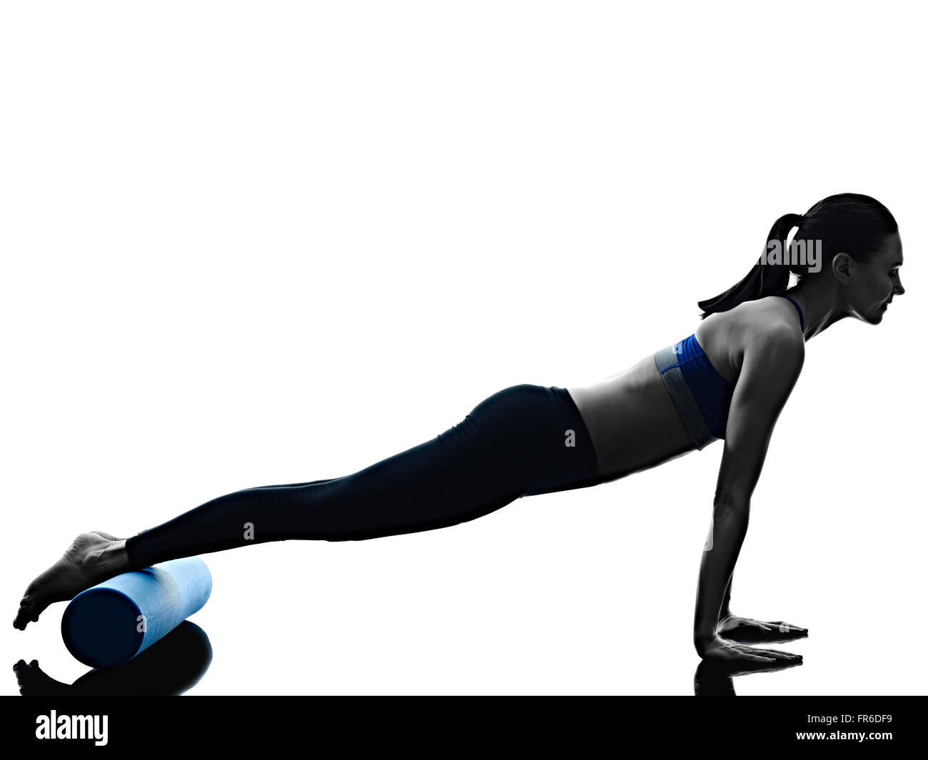 one caucasian woman exercising pilates roller exercises fitness in ...