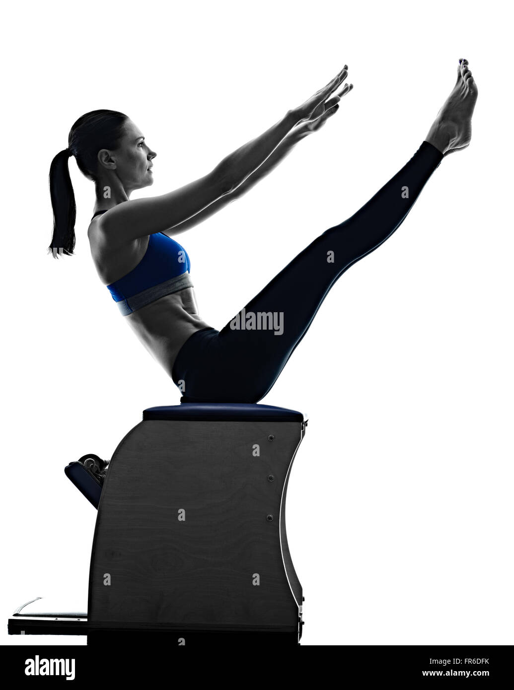 one caucasian woman exercising pilates chair exercises fitness in ...