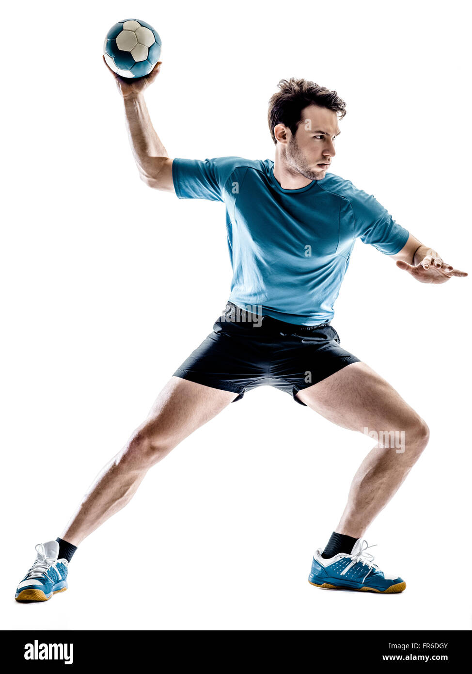 one young man handball player in studio on isolated white background ...
