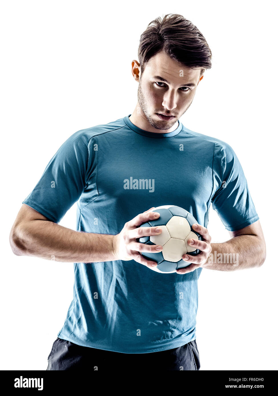 one young man handball player in studio on isolated white background ...