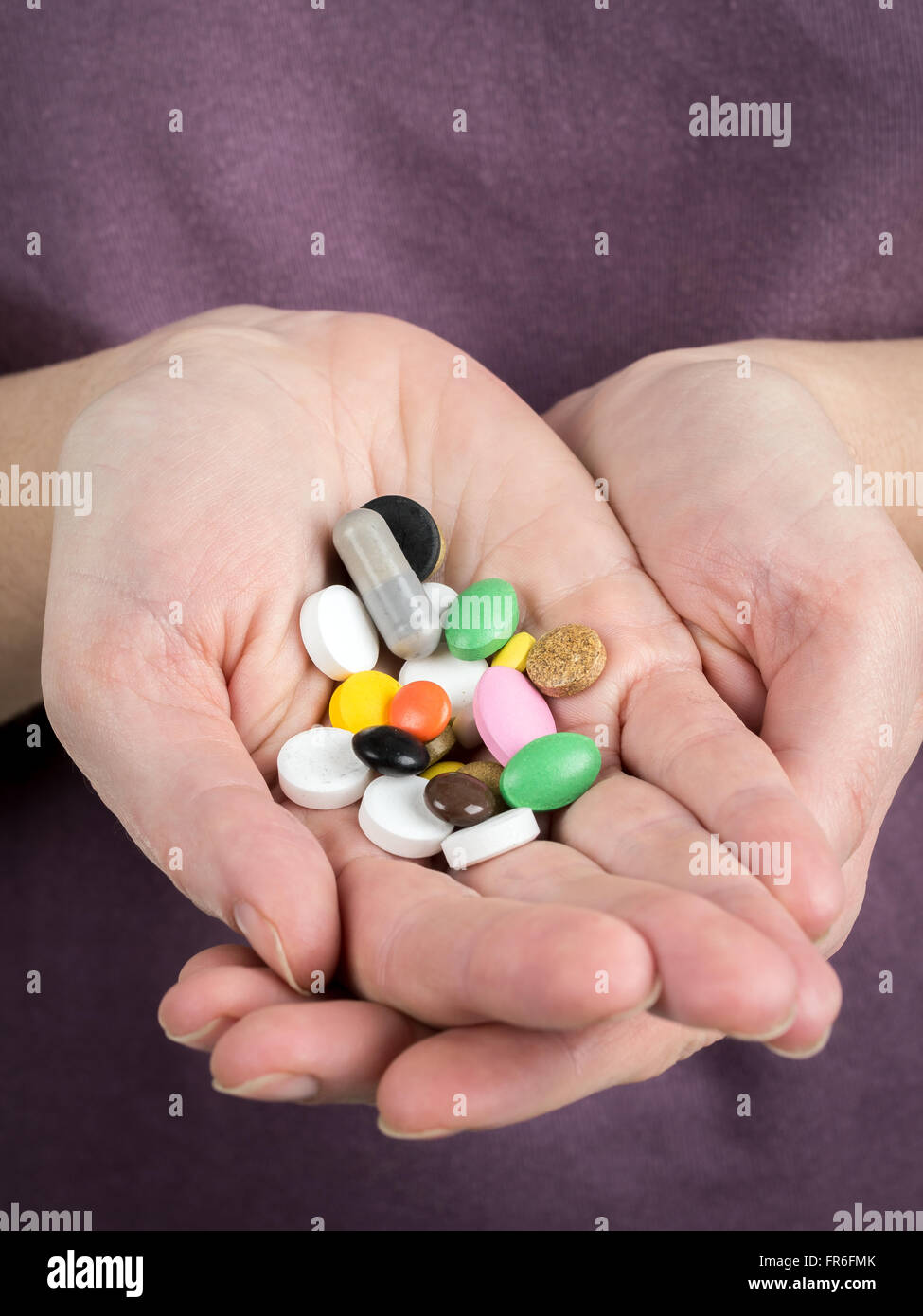 Hand holding vitamin tablets hi-res stock photography and images - Alamy