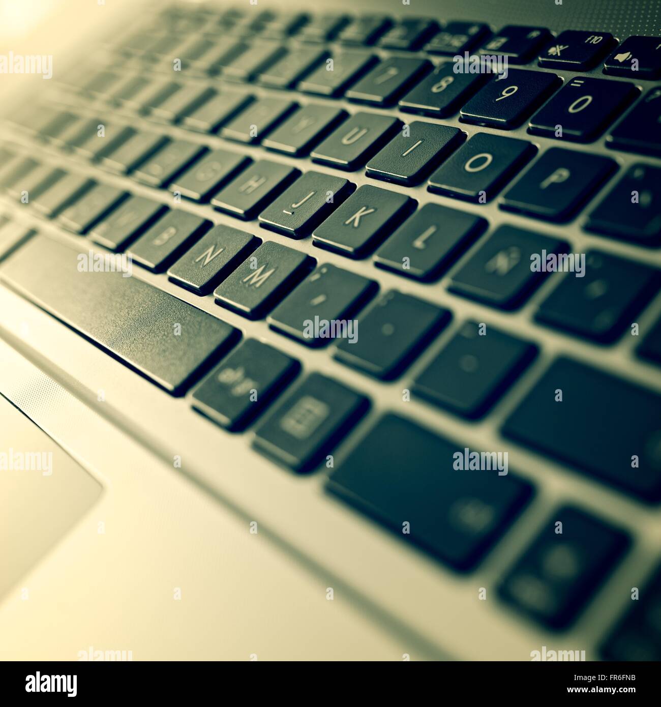 Forefront of a gray laptop keyboard Stock Photo - Alamy