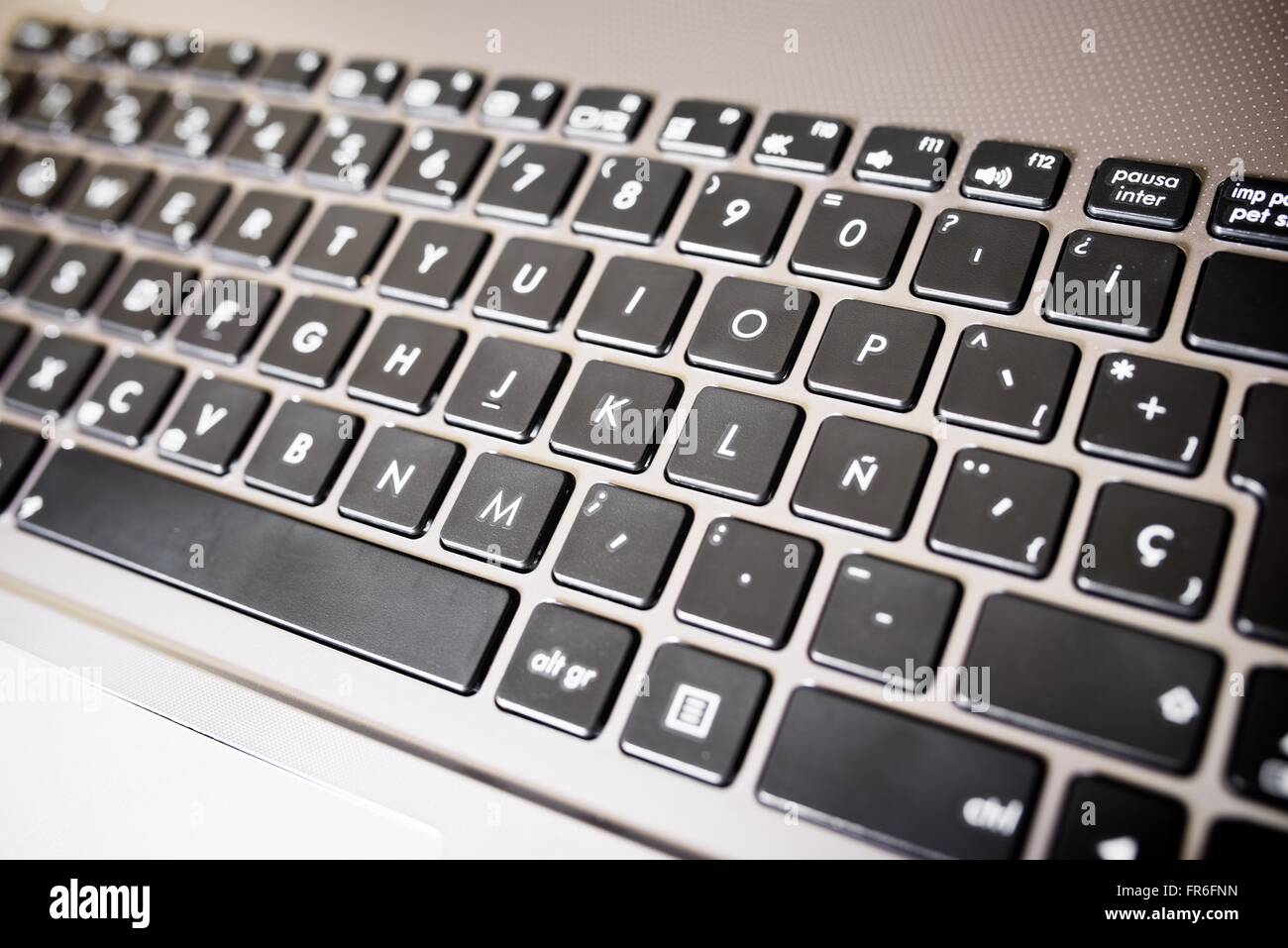 Forefront of a gray laptop keyboard Stock Photo - Alamy