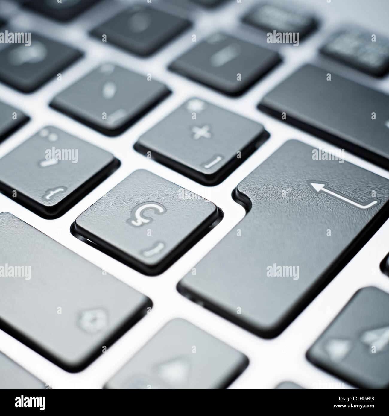 Forefront of a gray laptop keyboard Stock Photo - Alamy