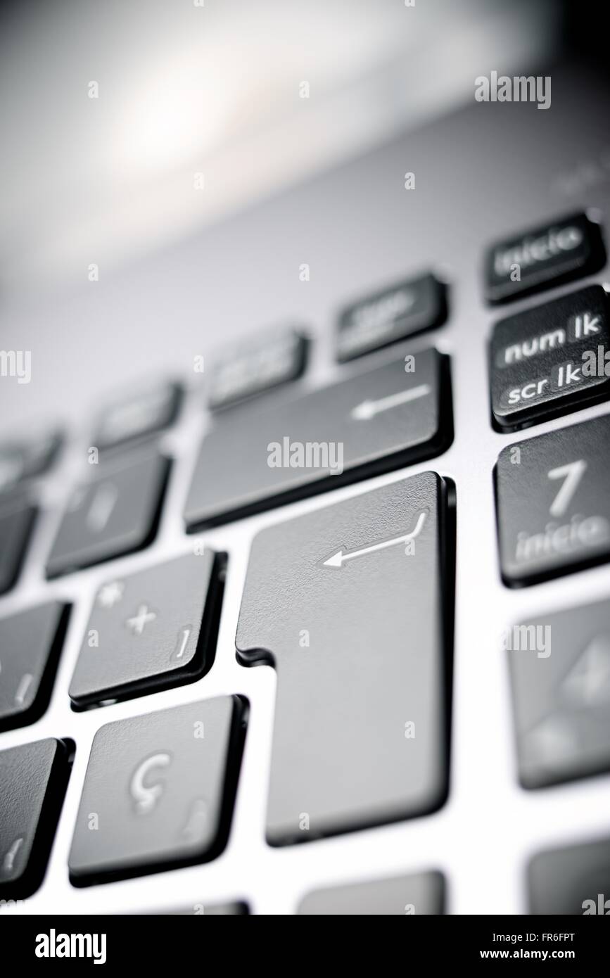 Forefront of a gray laptop keyboard Stock Photo - Alamy