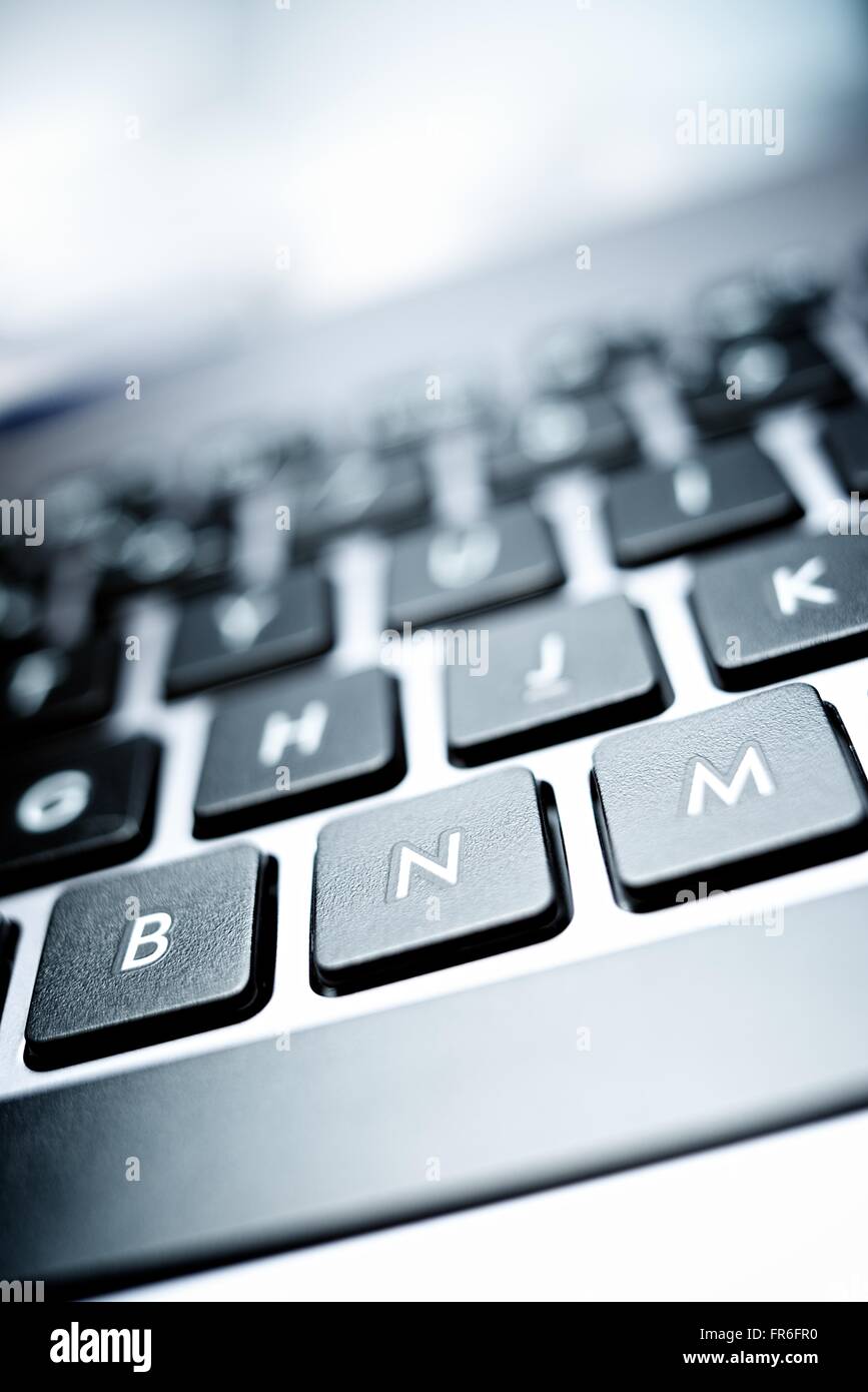 Forefront of a gray laptop keyboard Stock Photo - Alamy