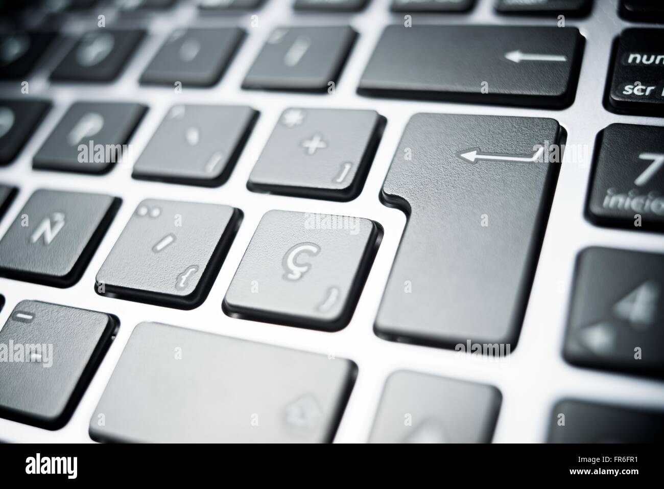 Forefront of a gray laptop keyboard Stock Photo - Alamy