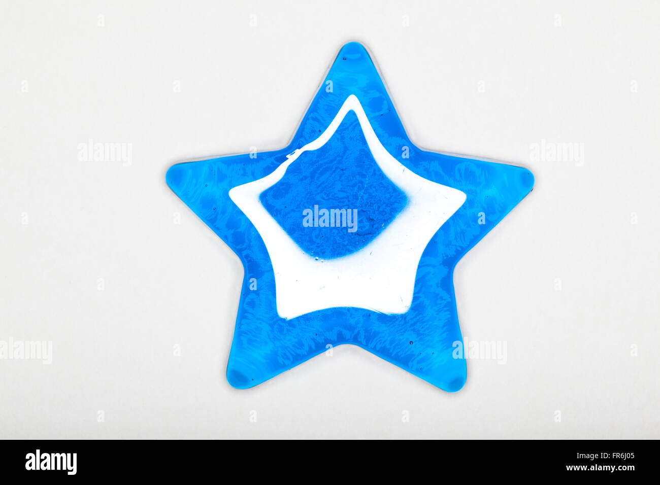 A blue glass star Stock Photo - Alamy
