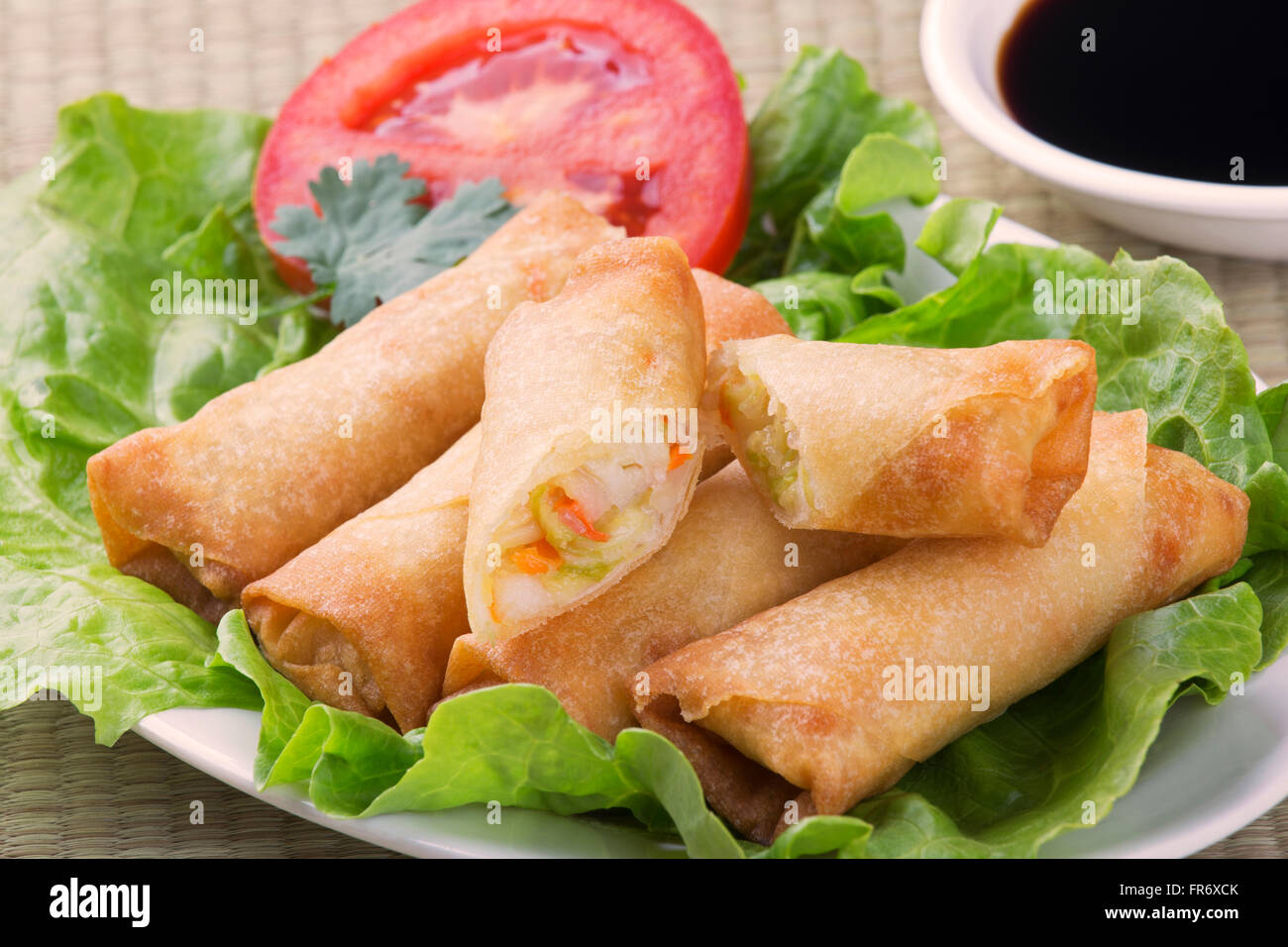 Traditional Chinese Spring Rolls with a dipping sause of soy sause ...
