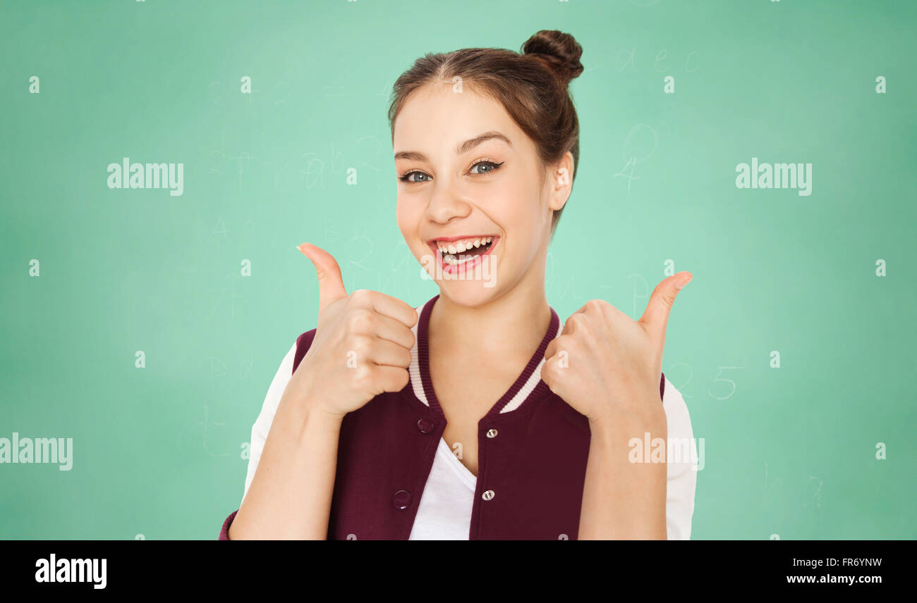 happy teenage student girl showing thumbs up Stock Photo - Alamy