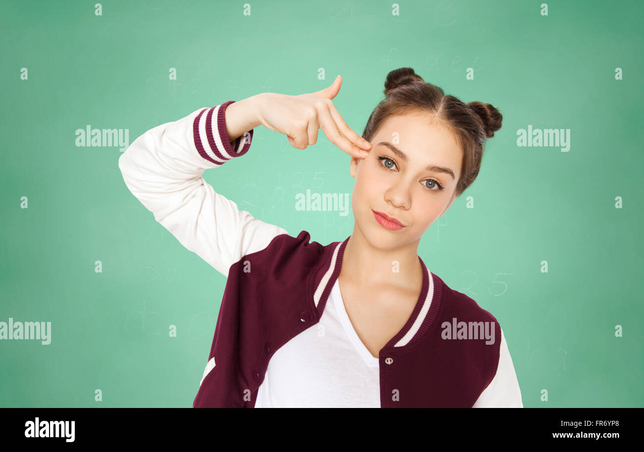 bored student girl making finger gun gesture Stock Photo - Alamy