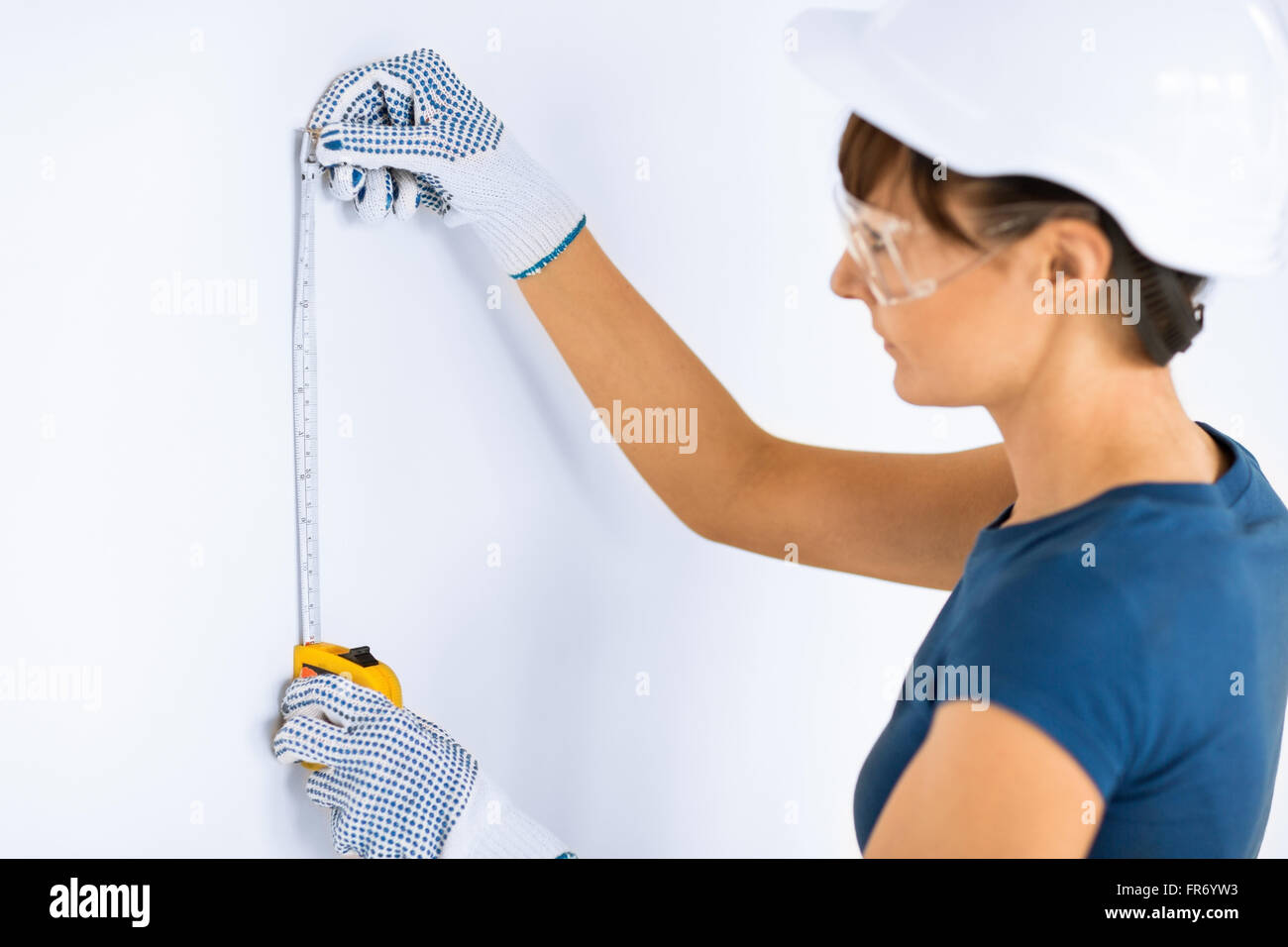 architect measuring wall with flexible ruller Stock Photo - Alamy
