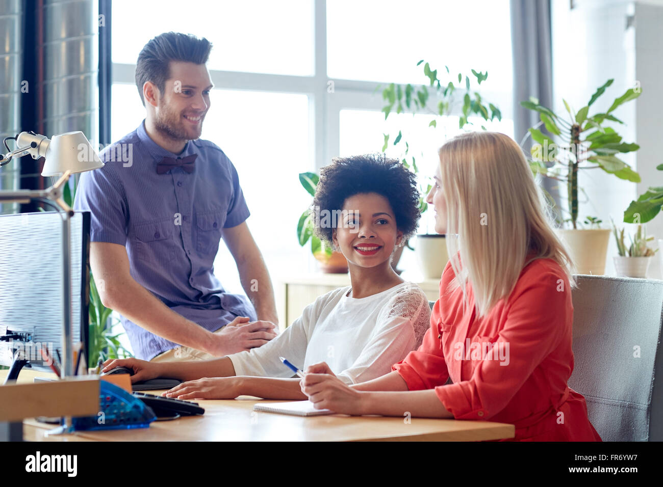 Happy successful businesswoman talking multiethnic hi-res stock ...