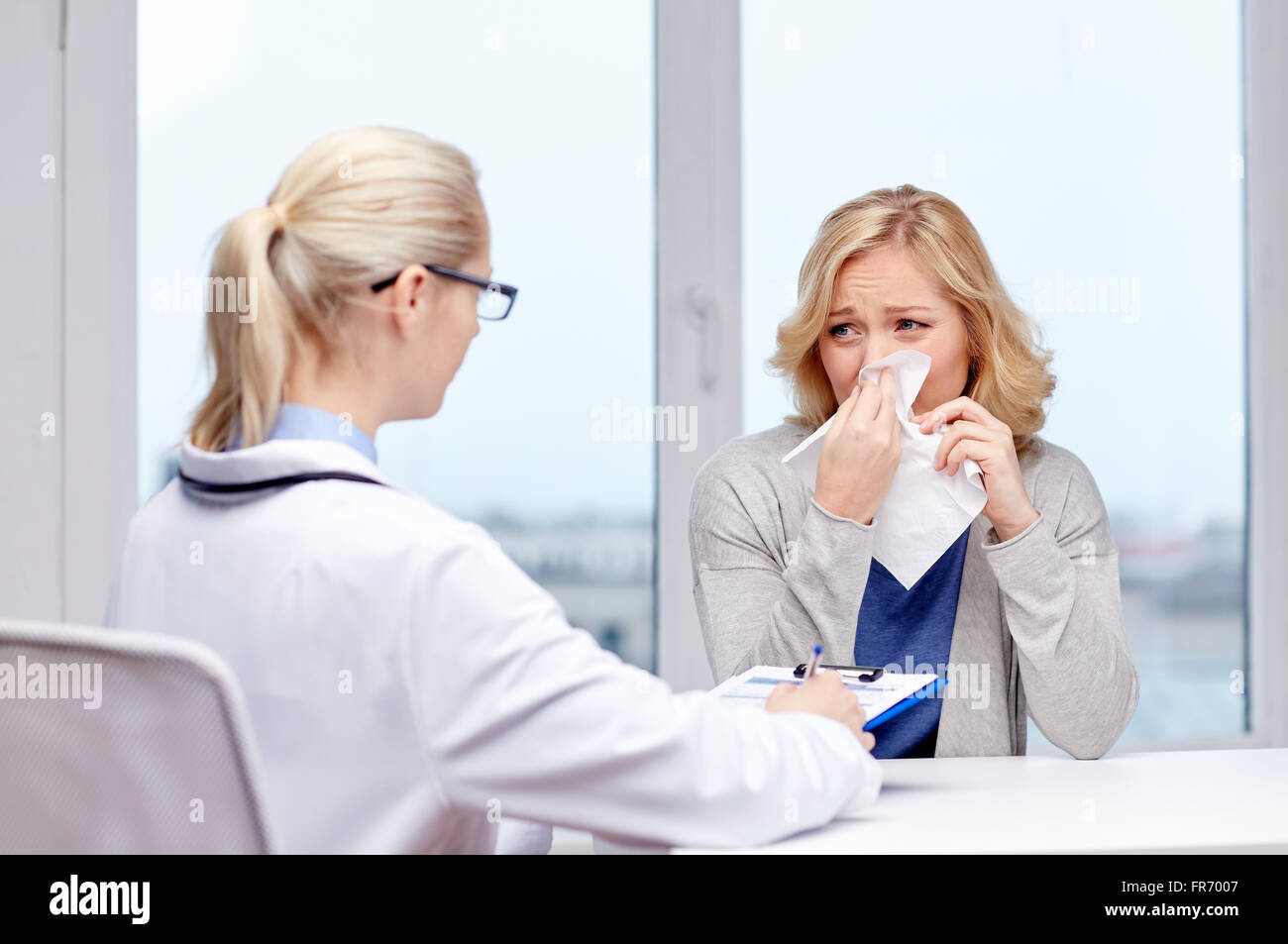 doctor and ill woman patient with flu at clinic Stock Photo - Alamy