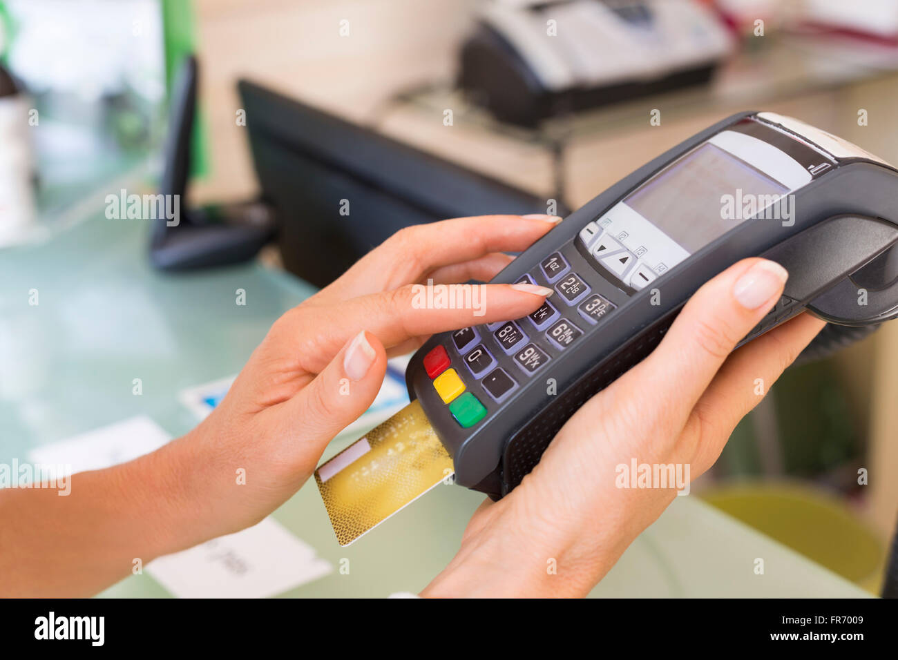 Closeup hands woman with credit card swipe through terminal for sale in ...
