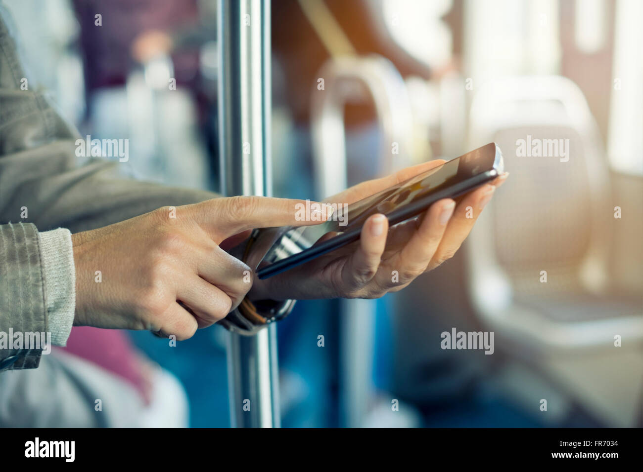 Female using her mobile phone on bus. Tramway, Sms, message, app. Lens ...