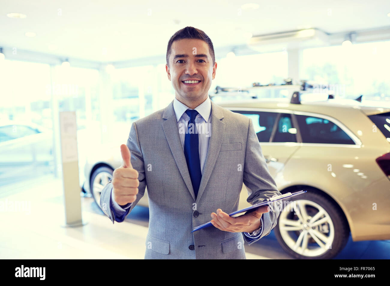 happy man at auto show or car salon Stock Photo - Alamy