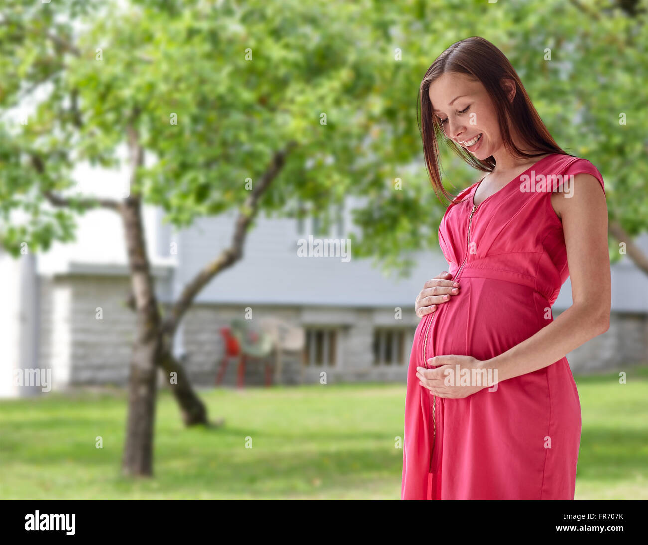 happy pregnant woman with big tummy Stock Photo - Alamy