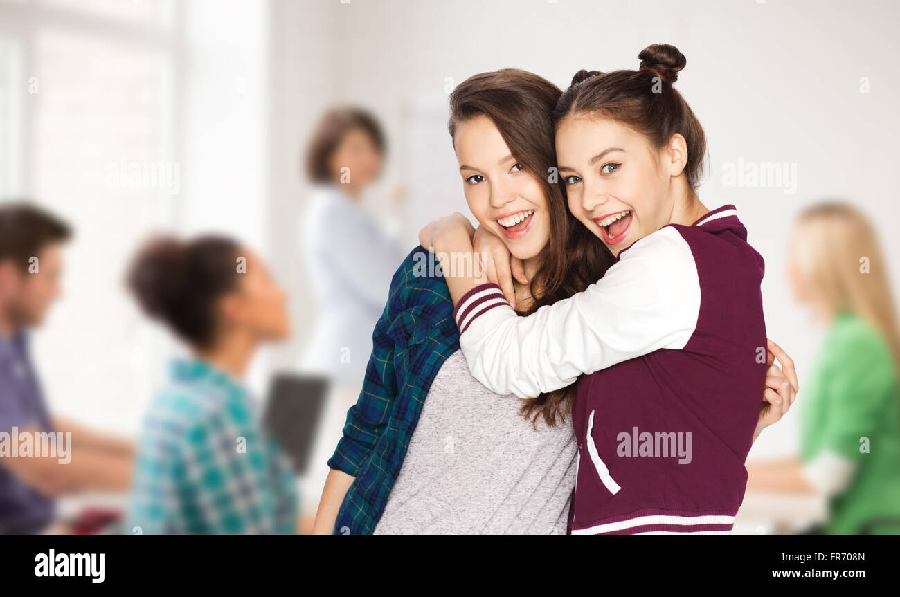 Two school girls hugging hi-res stock photography and images - Alamy