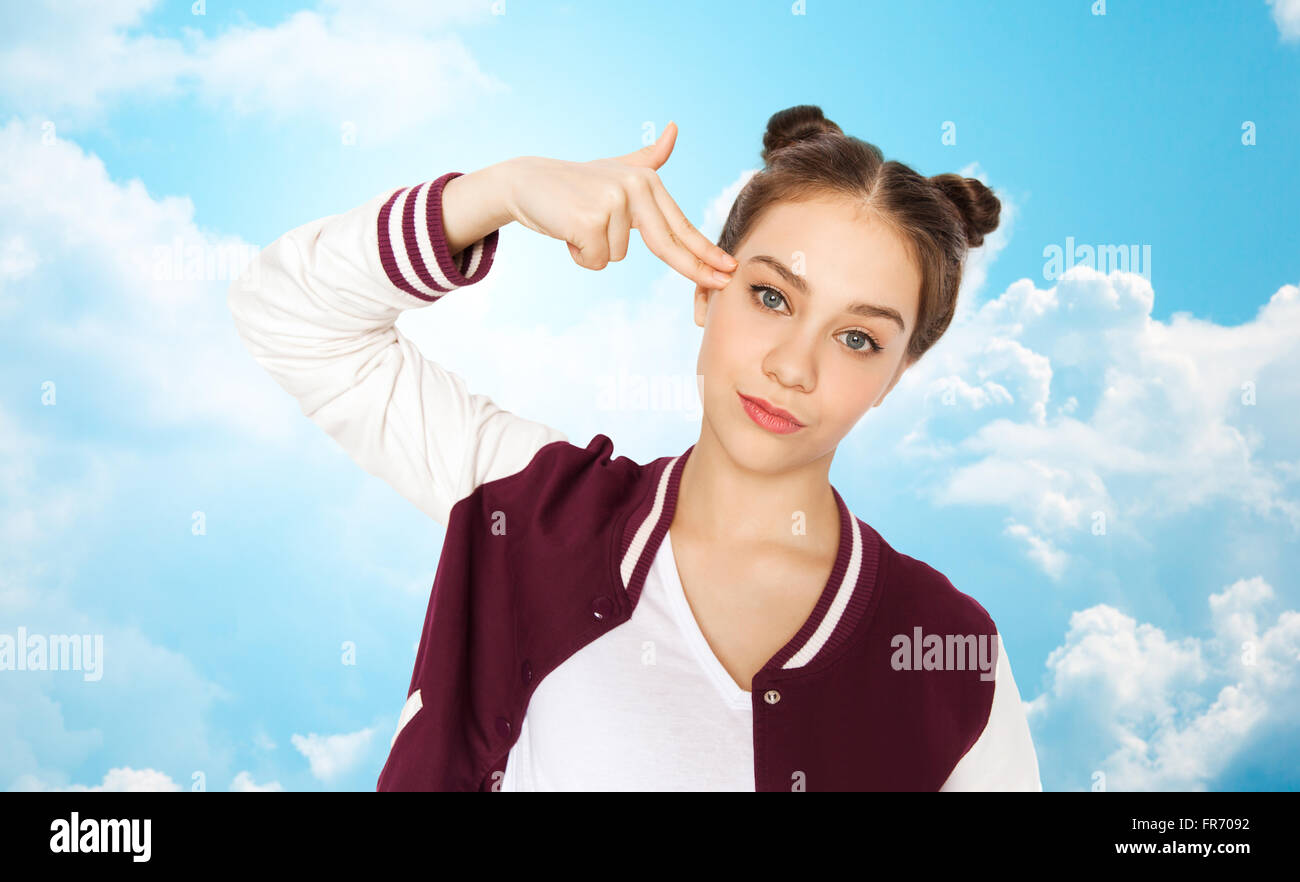 bored teenage girl making finger gun gesture Stock Photo - Alamy