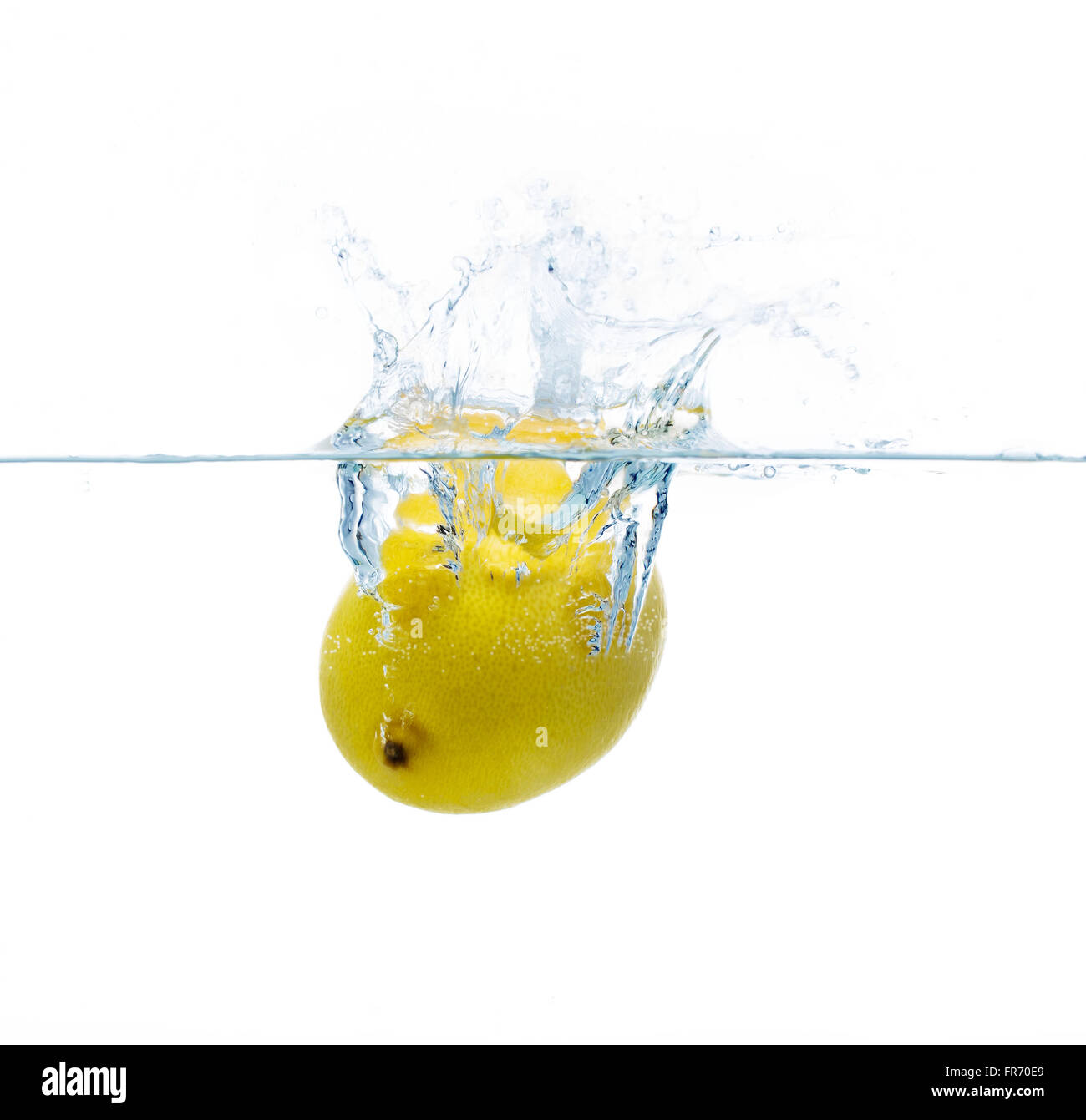 lemon falling or dipping in water with splash Stock Photo - Alamy