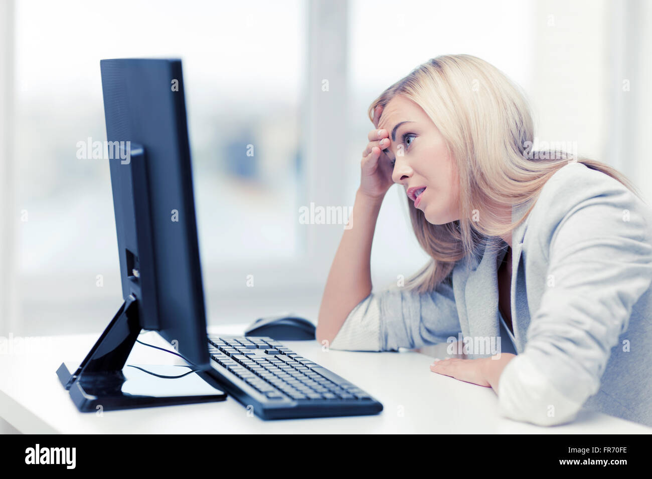 stressed woman with computer Stock Photo - Alamy