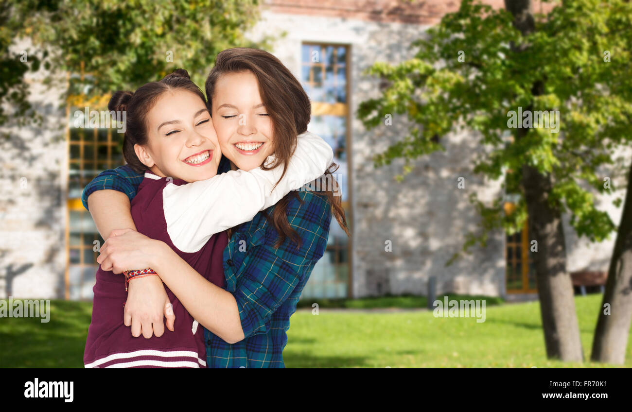 happy smiling pretty teenage student girls hugging Stock Photo - Alamy