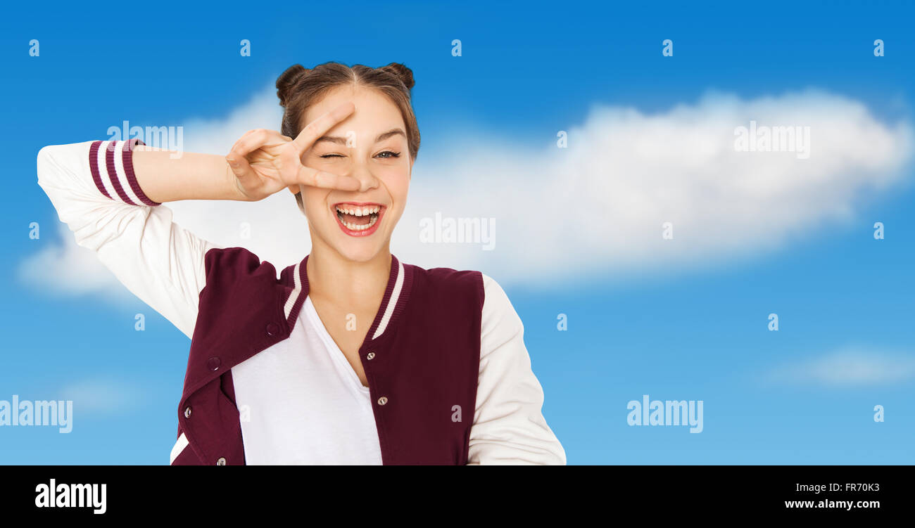 happy smiling teenage girl showing peace sign Stock Photo - Alamy