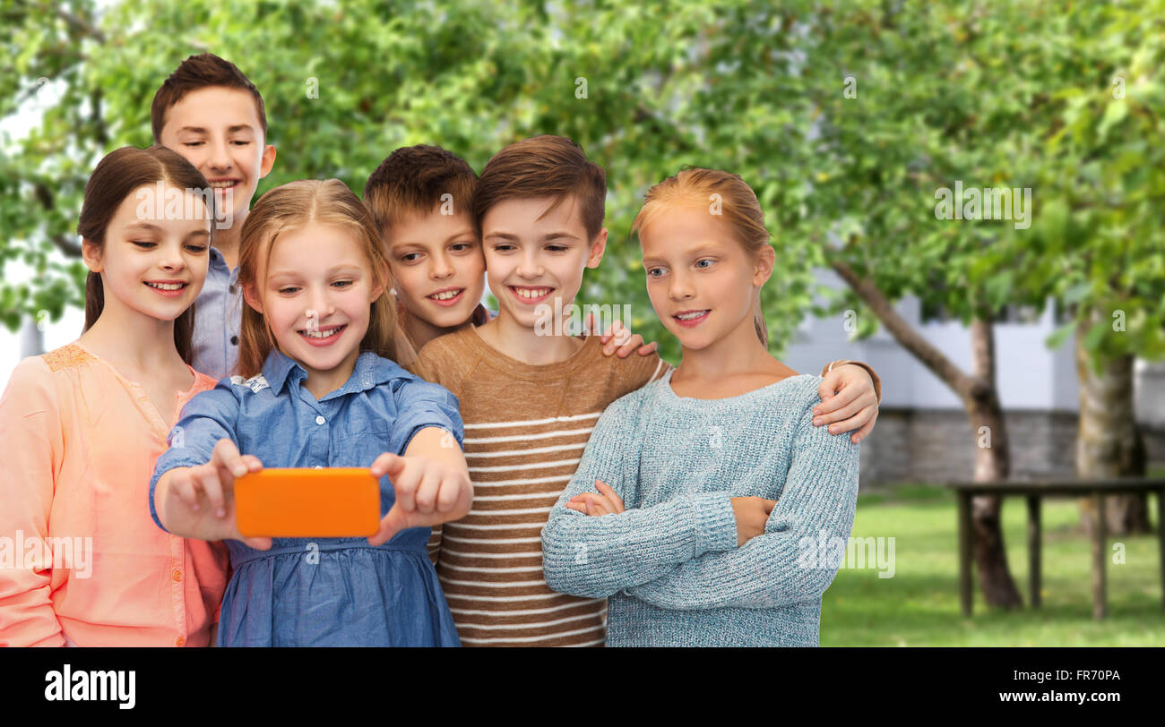 happy children talking selfie by smartphone Stock Photo - Alamy