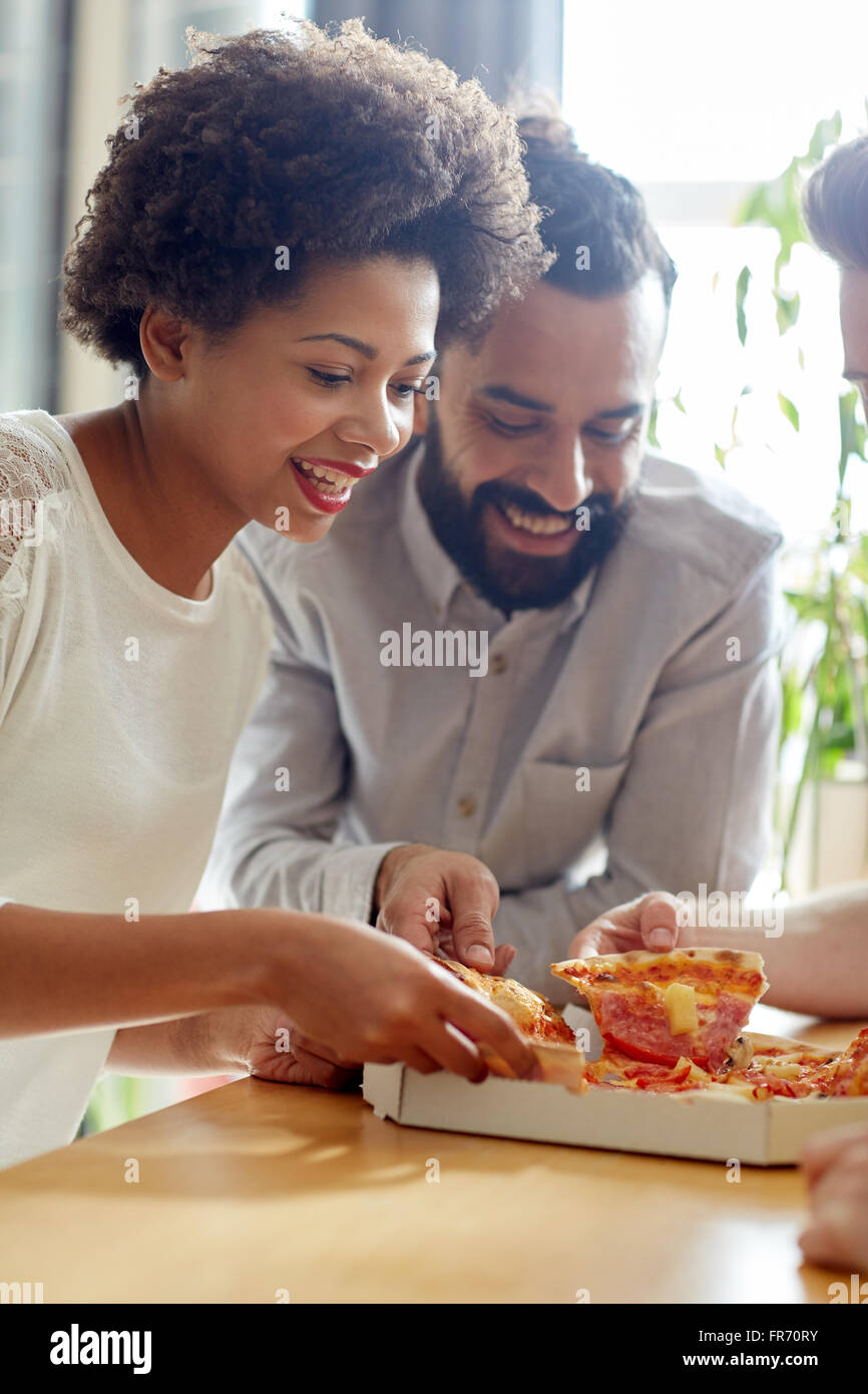 happy business team eating pizza in office Stock Photo - Alamy