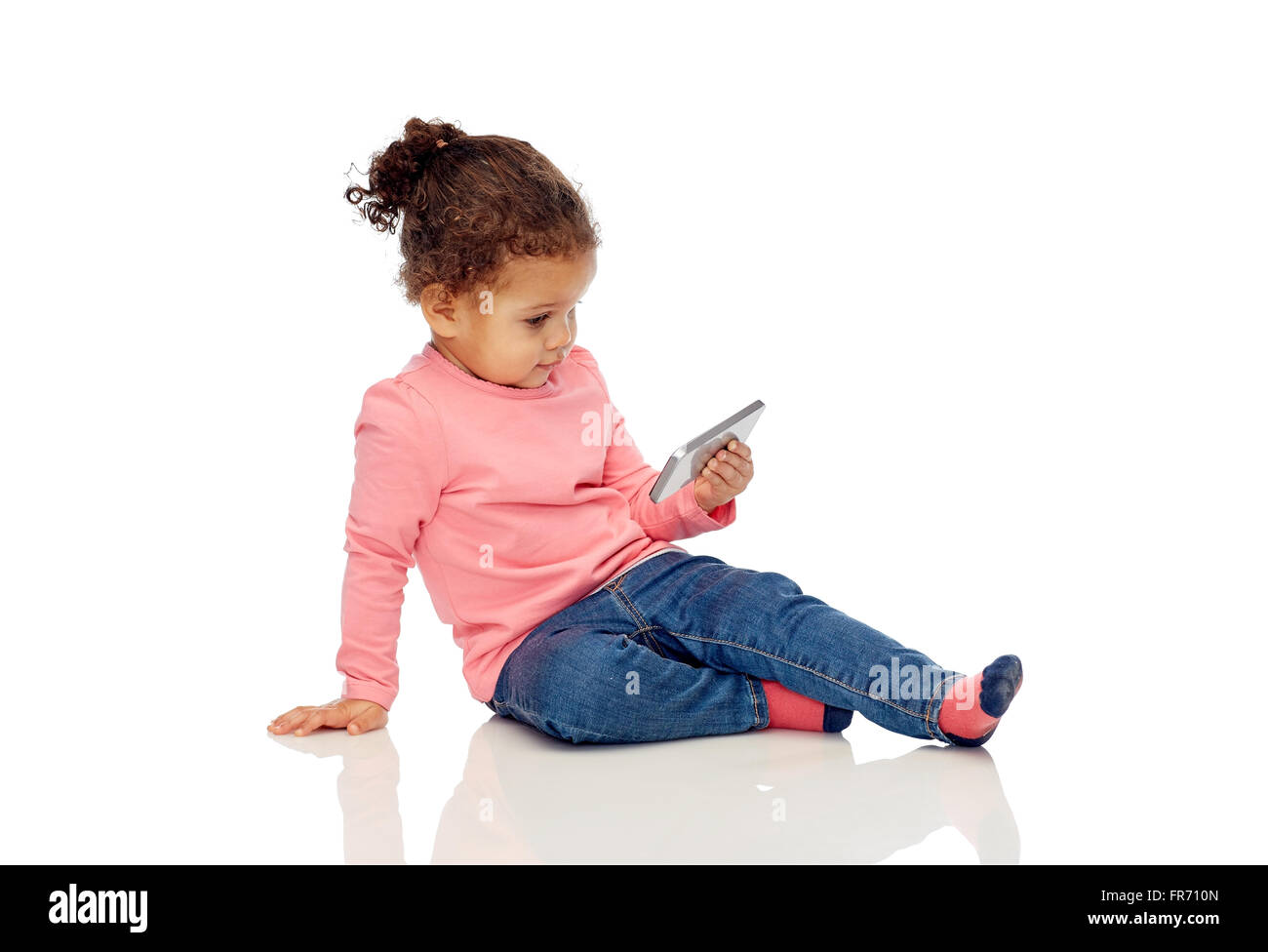 smiling little baby girl playing with smartphone Stock Photo - Alamy