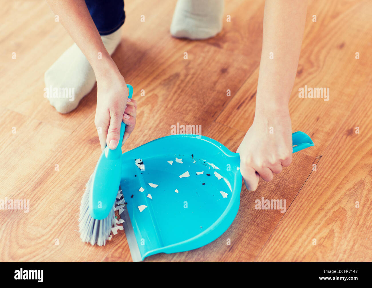 Woman sweeping floor hi-res stock photography and images - Alamy