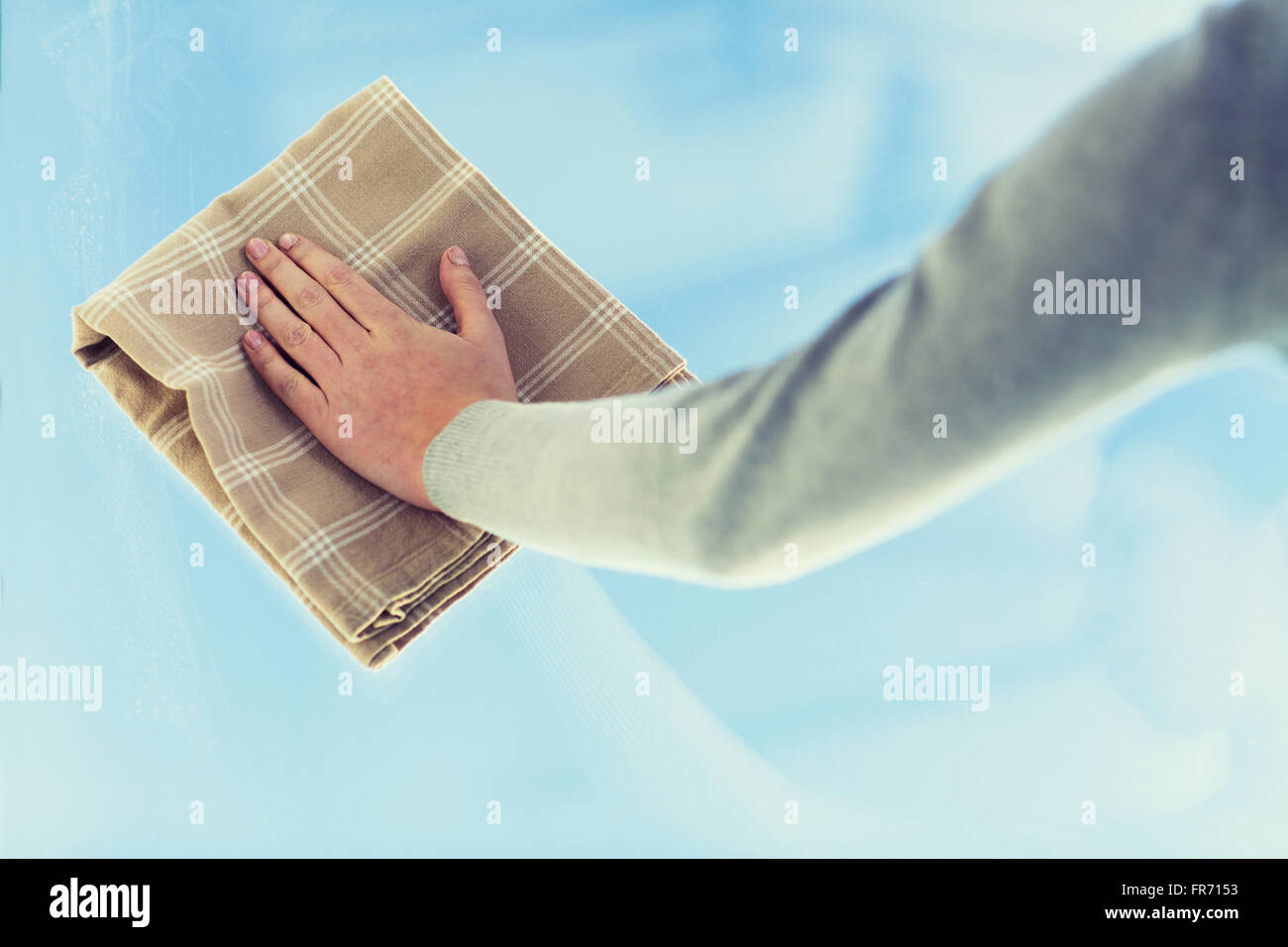 close up of woman hand cleaning window with cloth Stock Photo - Alamy