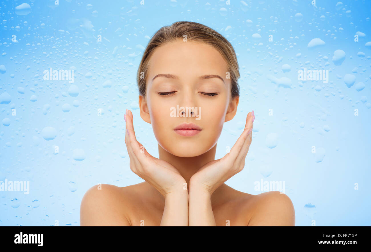 young woman face and hands Stock Photo - Alamy