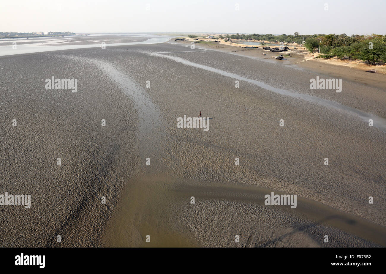 Mud beds on the river Matla during low tide the water in the Canning ...