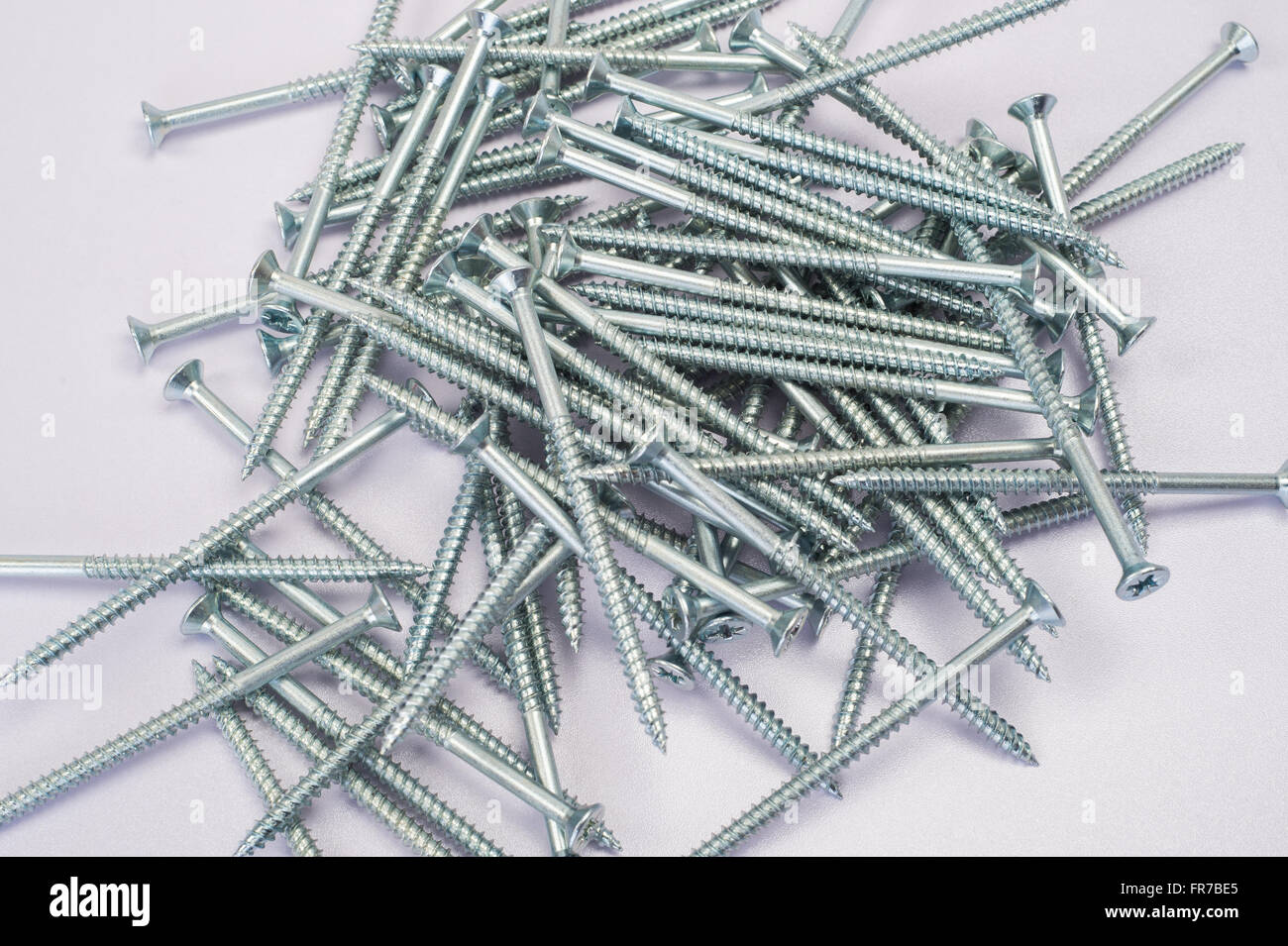 An image of large wood screws, shown randomly scattered Stock Photo - Alamy