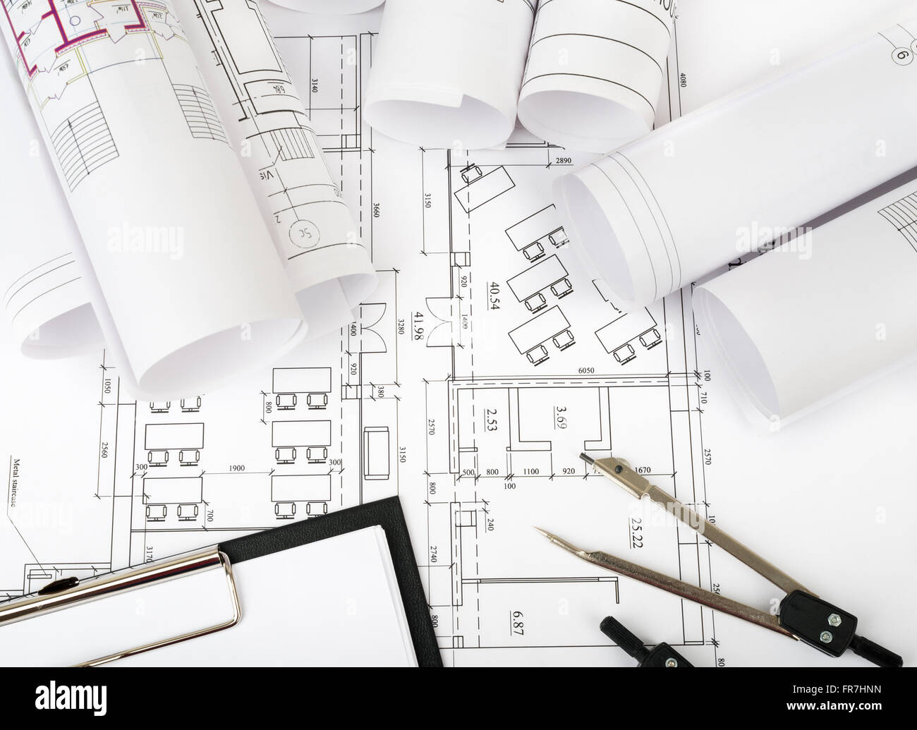 Architecture plan and rolls of blueprints Stock Photo - Alamy