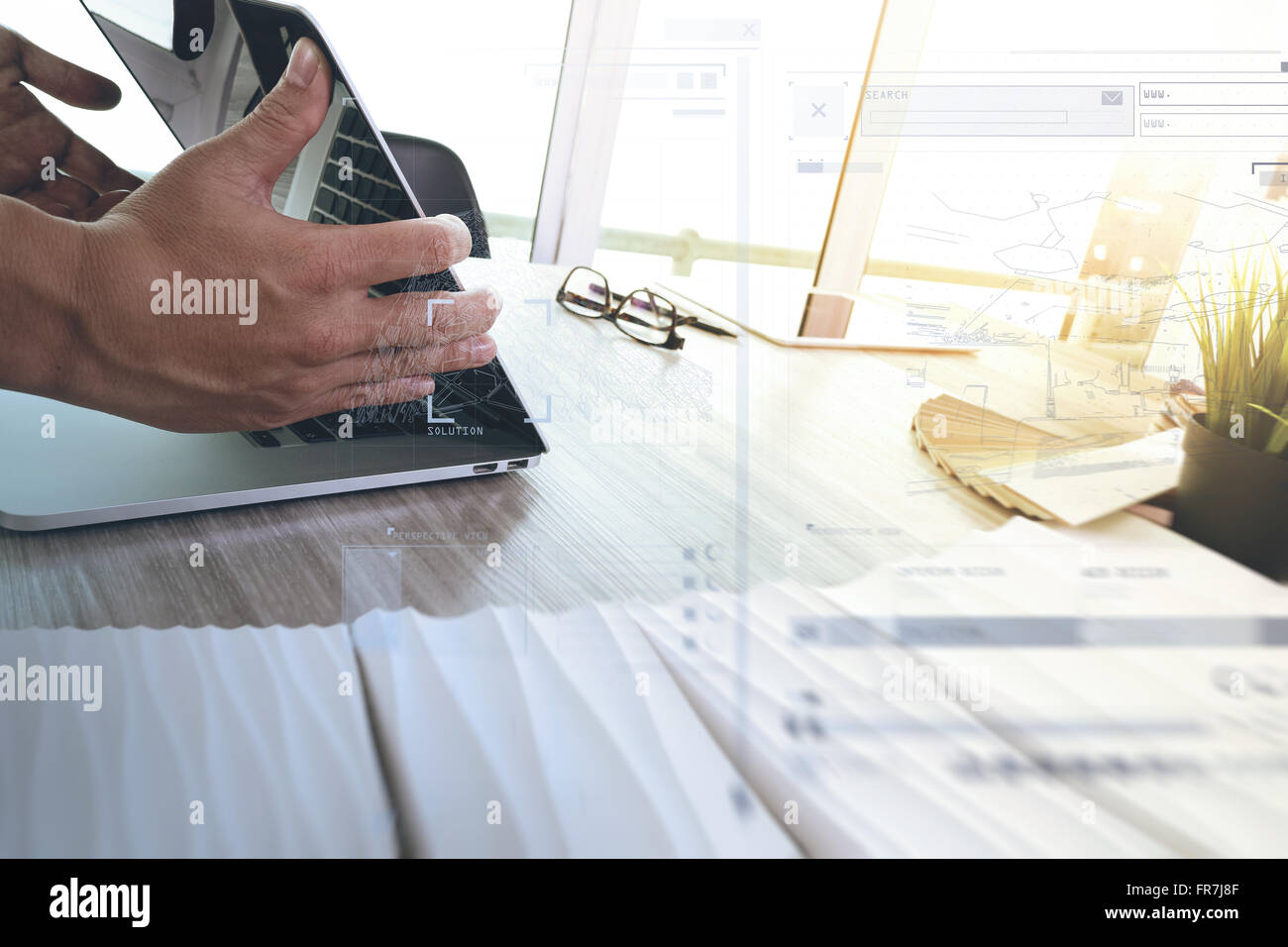 interior designer hand working with modern laptop computer and sample ...