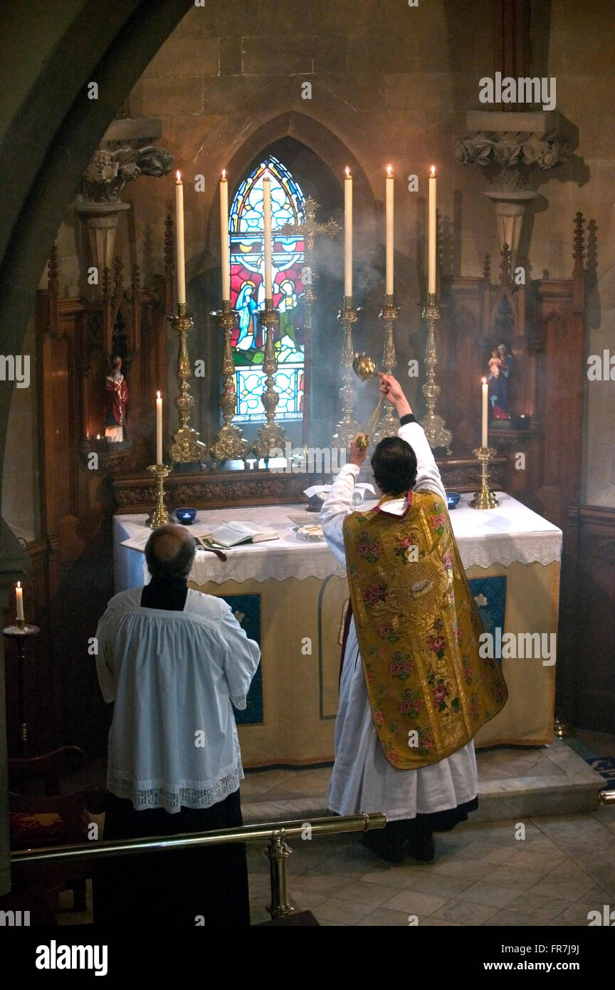 A priest censes the altar in an Anglo - Catholic church in Hay on Wye ...
