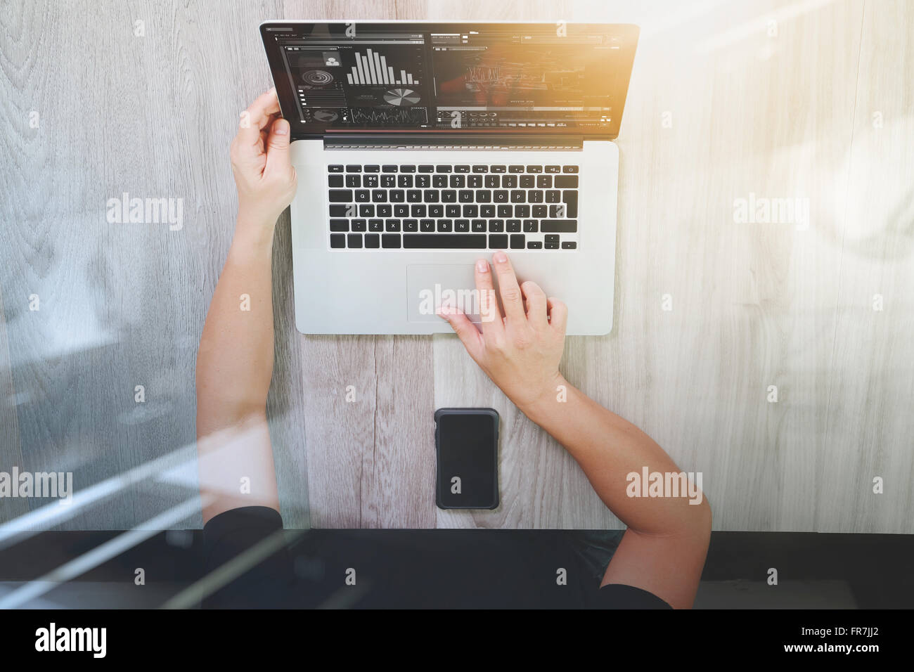 top view of Designer hand working with laptop computer and smarth phone ...