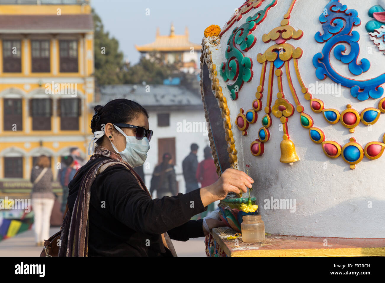 Kathmandu, Nepal - December 03, 2014: Pilgrim visiting the Buddhist ...