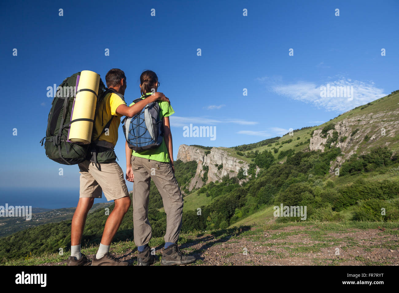 Two backpackers on top of a mountain Stock Photo - Alamy