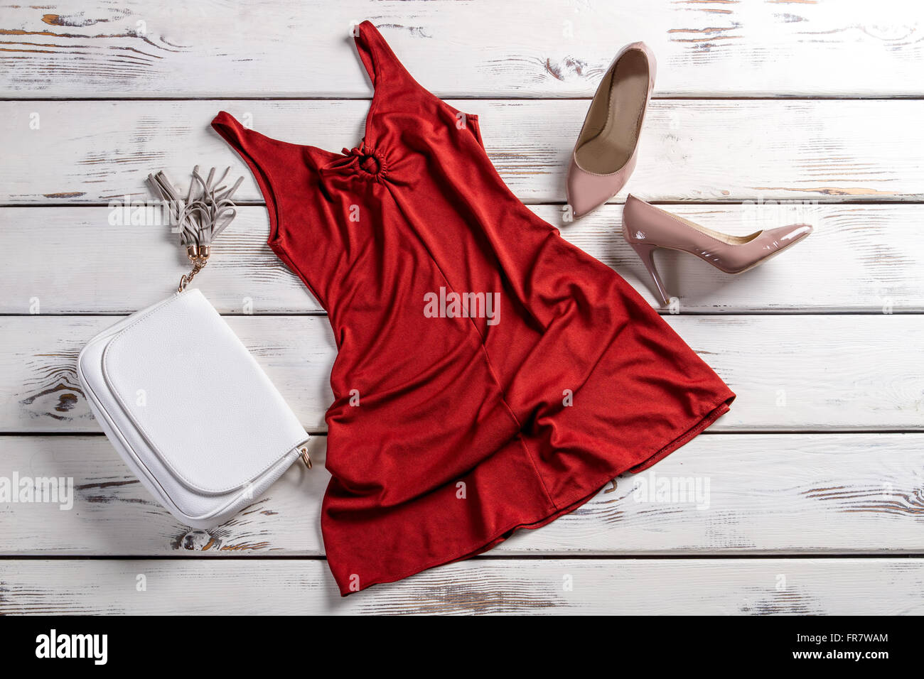 Clothes and footwear on table Stock Photo - Alamy