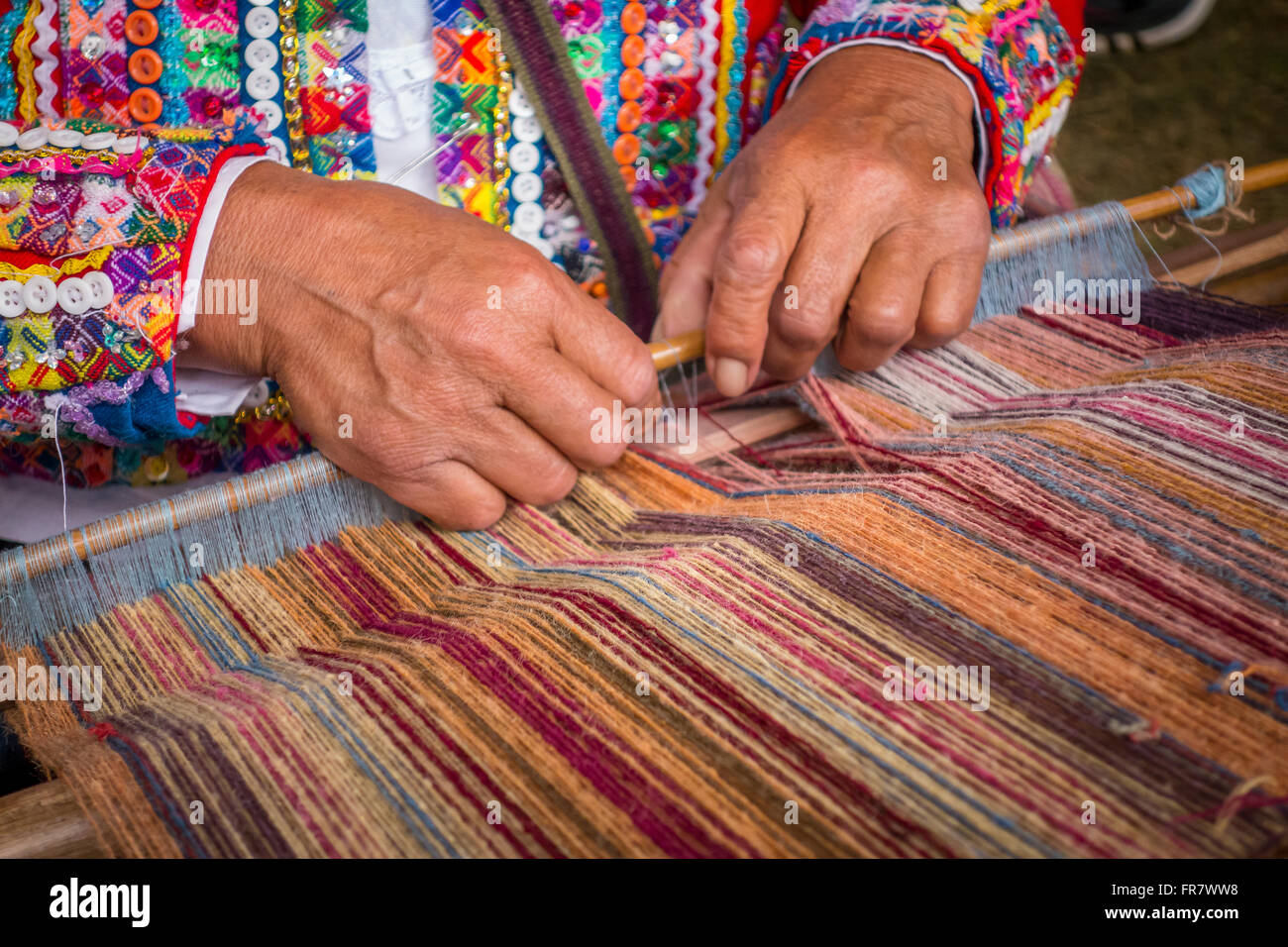 WASHINGTON, DC, USA - Woman from Cusco, Peru demonstrates weaving with ...