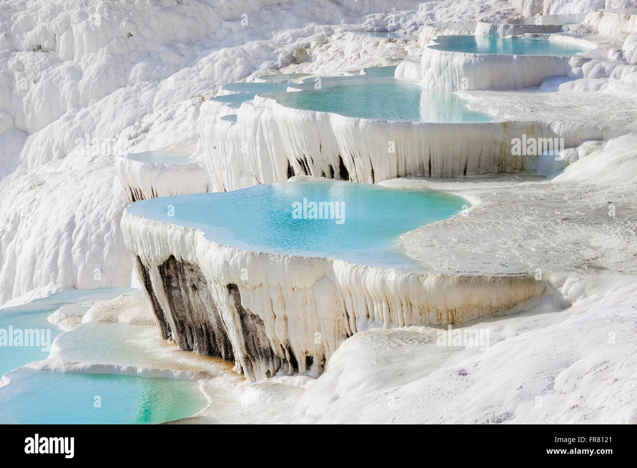 Hot springs and travertines, terraces of carbonate minerals left by the ...