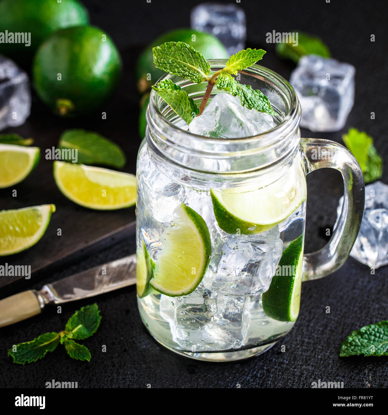 Drink with lime, mint and ice Stock Photo - Alamy