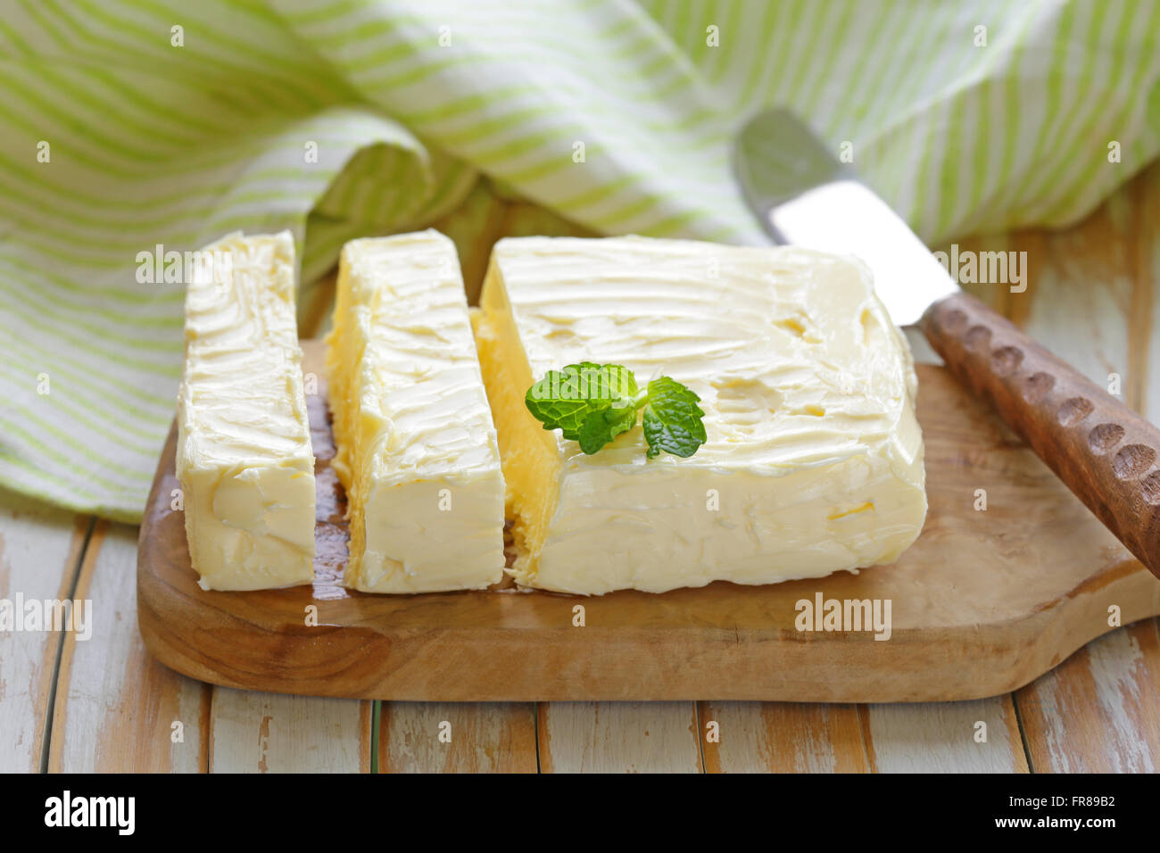 block of fresh organic butter on a wooden board Stock Photo - Alamy
