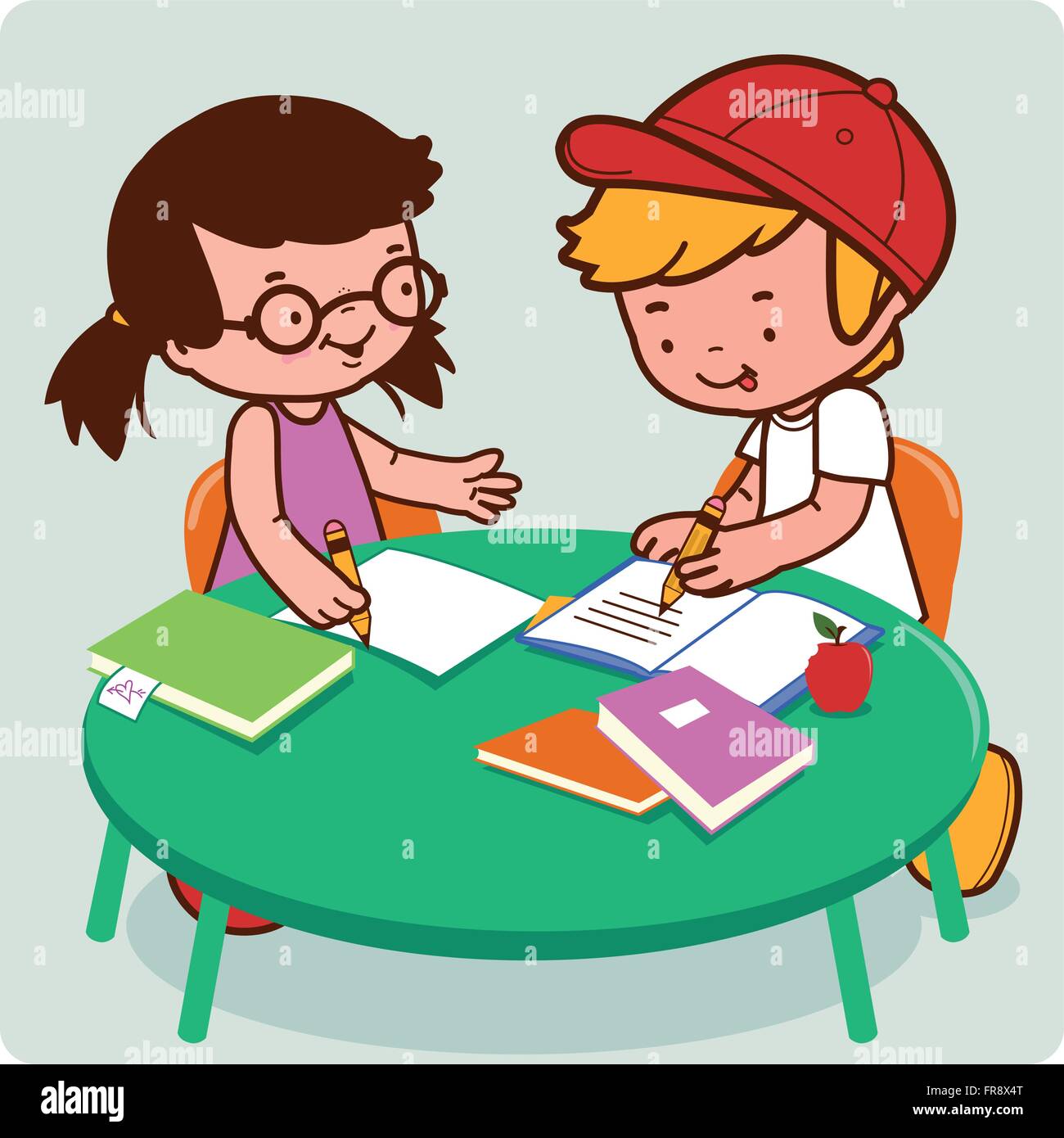 School children at a desk doing their homework. Kids students study in ...