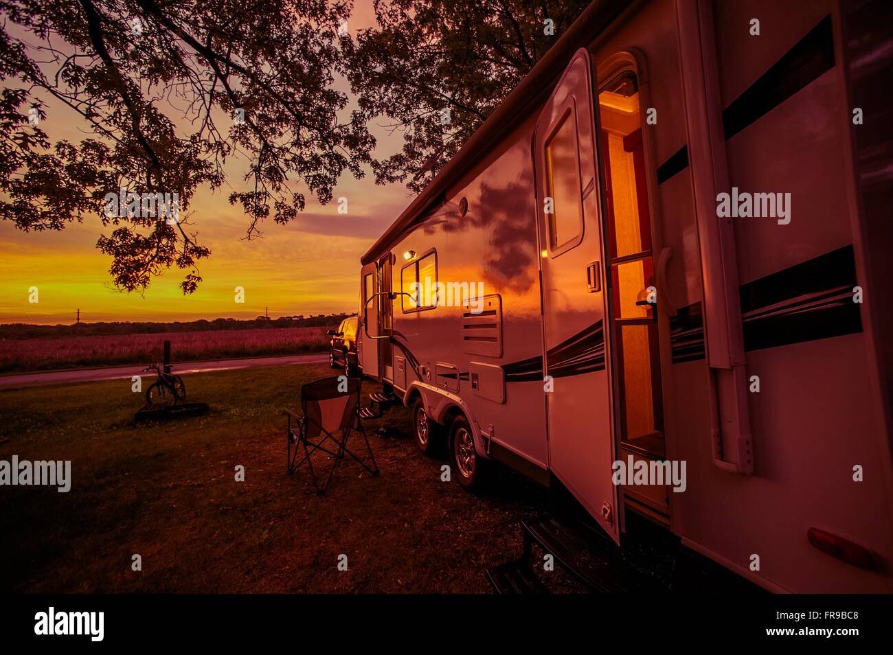 Travel Trailer Camping Spot at Scenic Sunset. Camper Traveling. Pulling ...