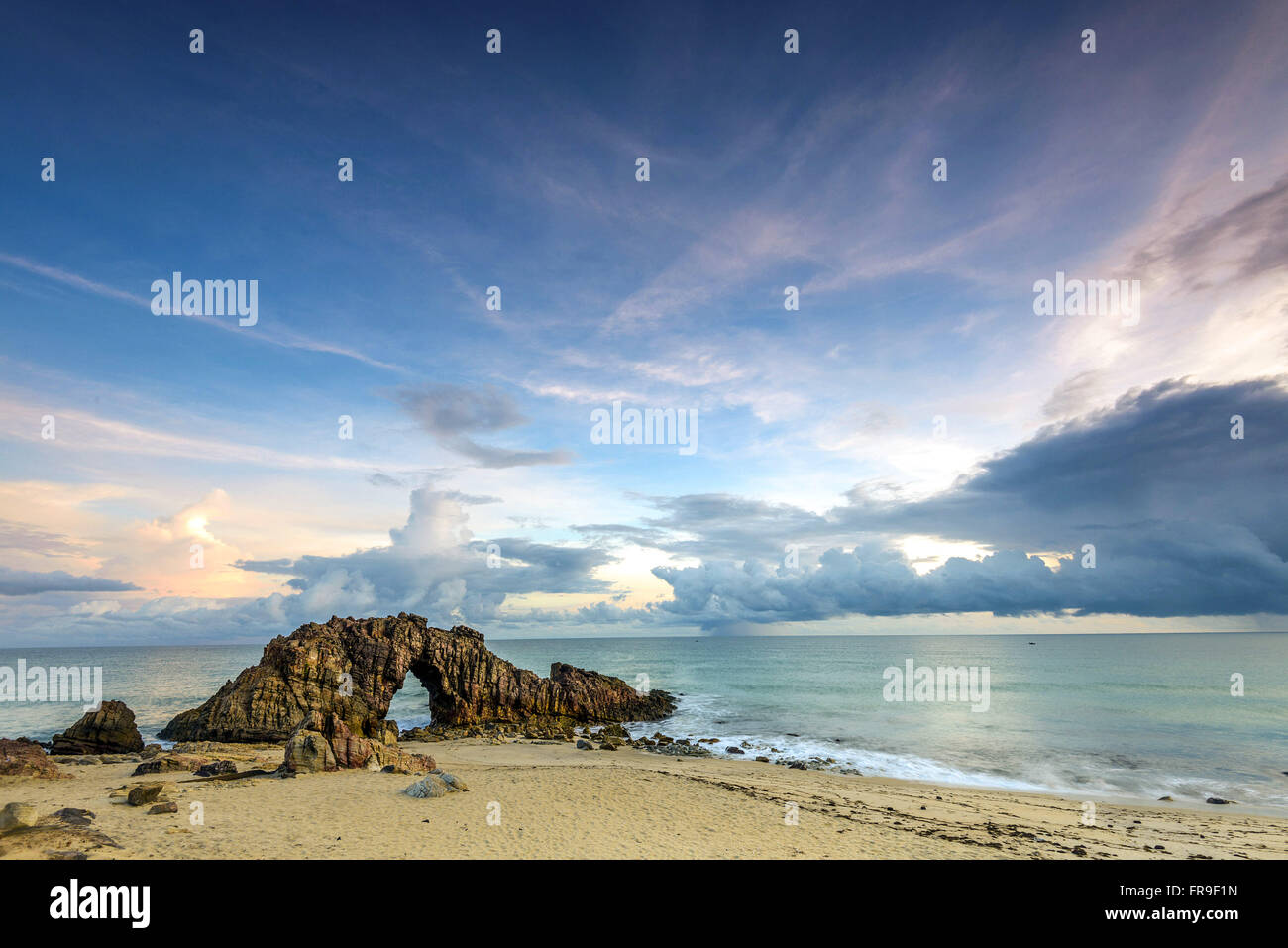 Holed Stone in Jericoacoara National Park Stock Photo - Alamy
